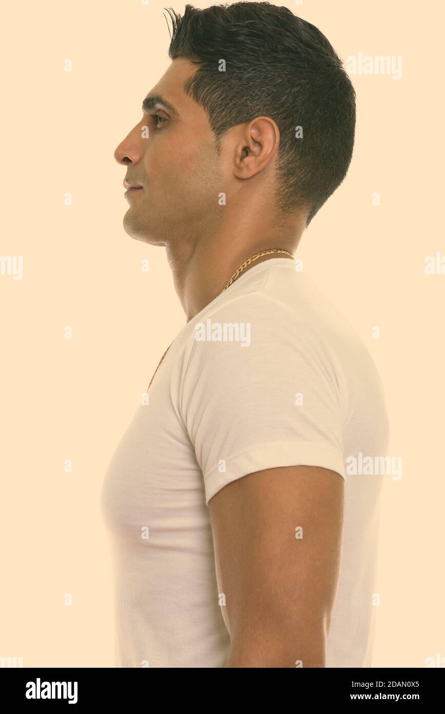 Profile view of young muscular Persian man Stock Photo - Alamy