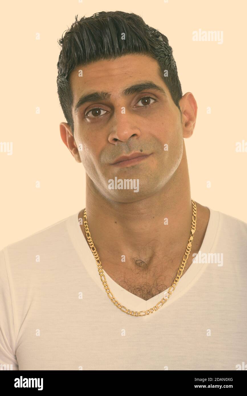 Studio shot of face of young muscular Persian man Stock Photo - Alamy