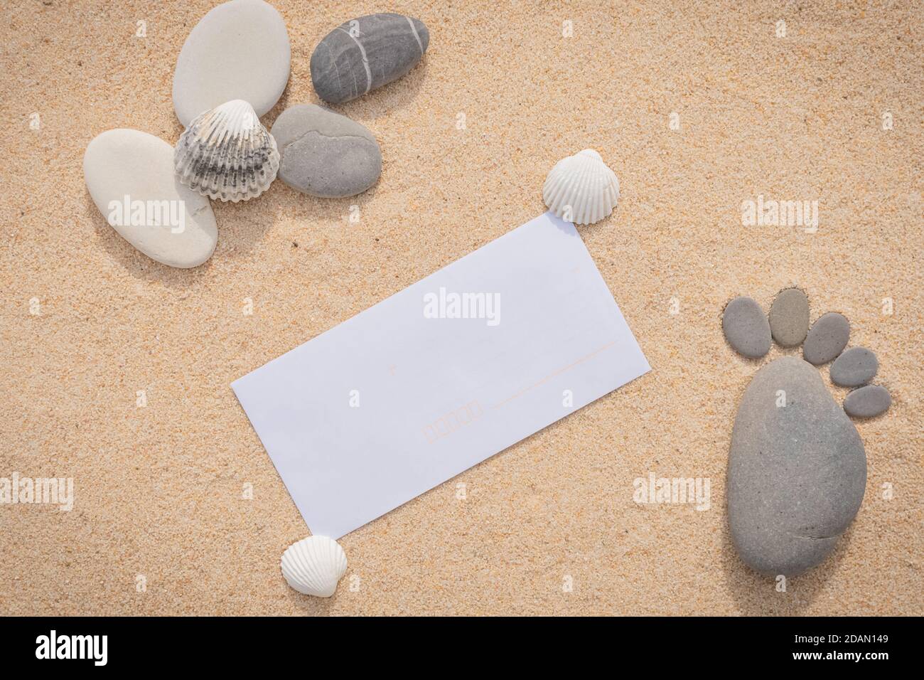 Background grains of sea sand, beach sand with envelope and pebble ...