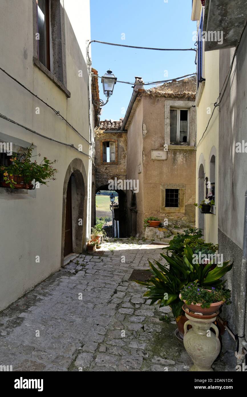 A narrow street among the old houses of Riccia, a medieval village in ...
