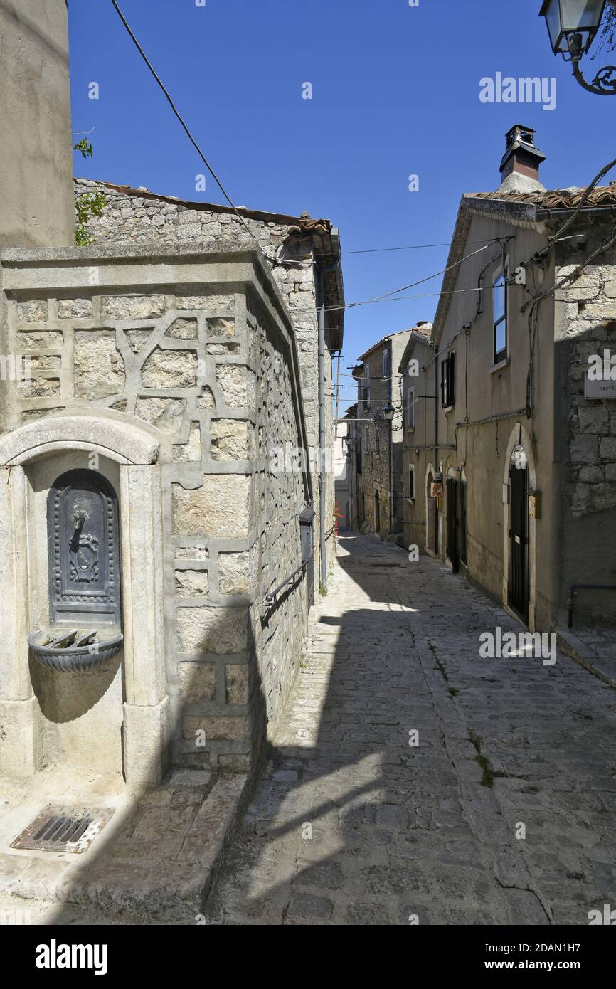 A narrow street among the old houses of Riccia, a medieval village in ...