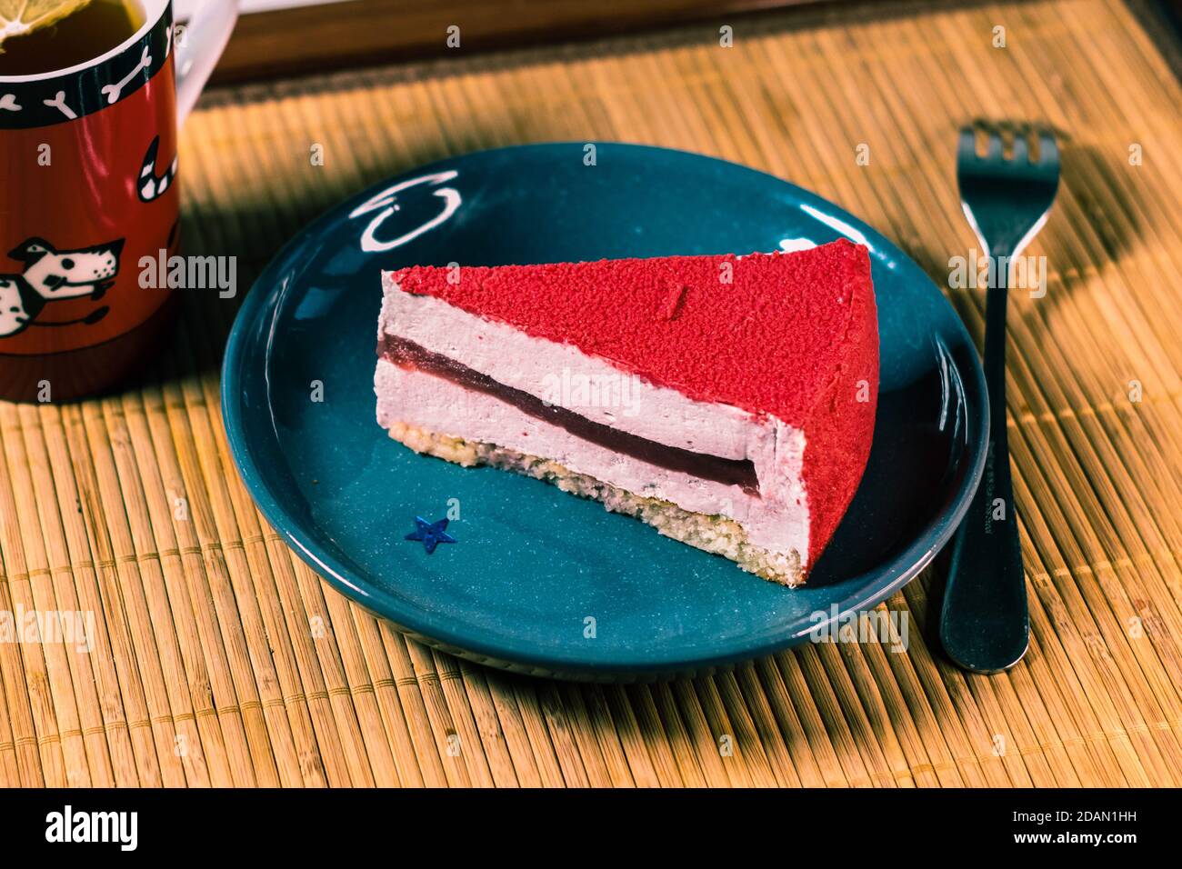 Raspberry holiday cheesecake Servings on a table with bamboo napkin ...