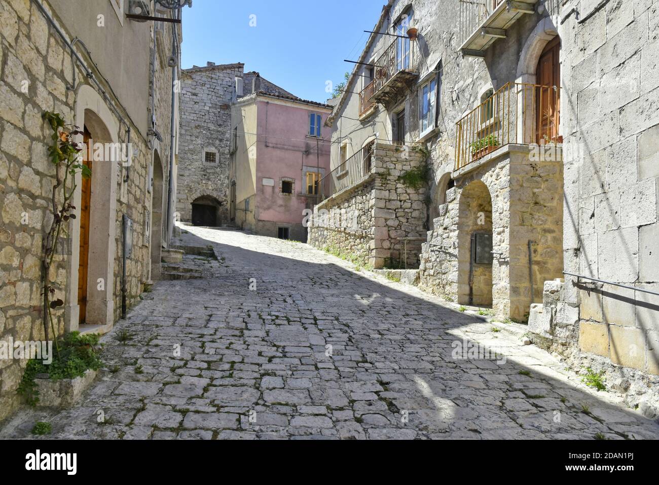 A narrow street among the old houses of Riccia, a medieval village in ...