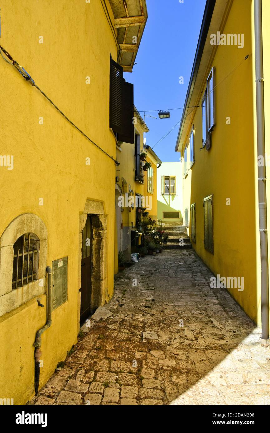 A narrow street among the old houses of Riccia, a medieval village in ...