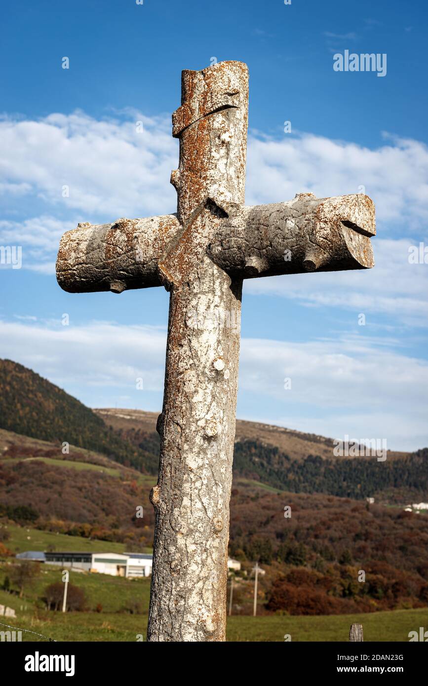 Ancient christian cross made of stone in a rural scene (imitation of a ...