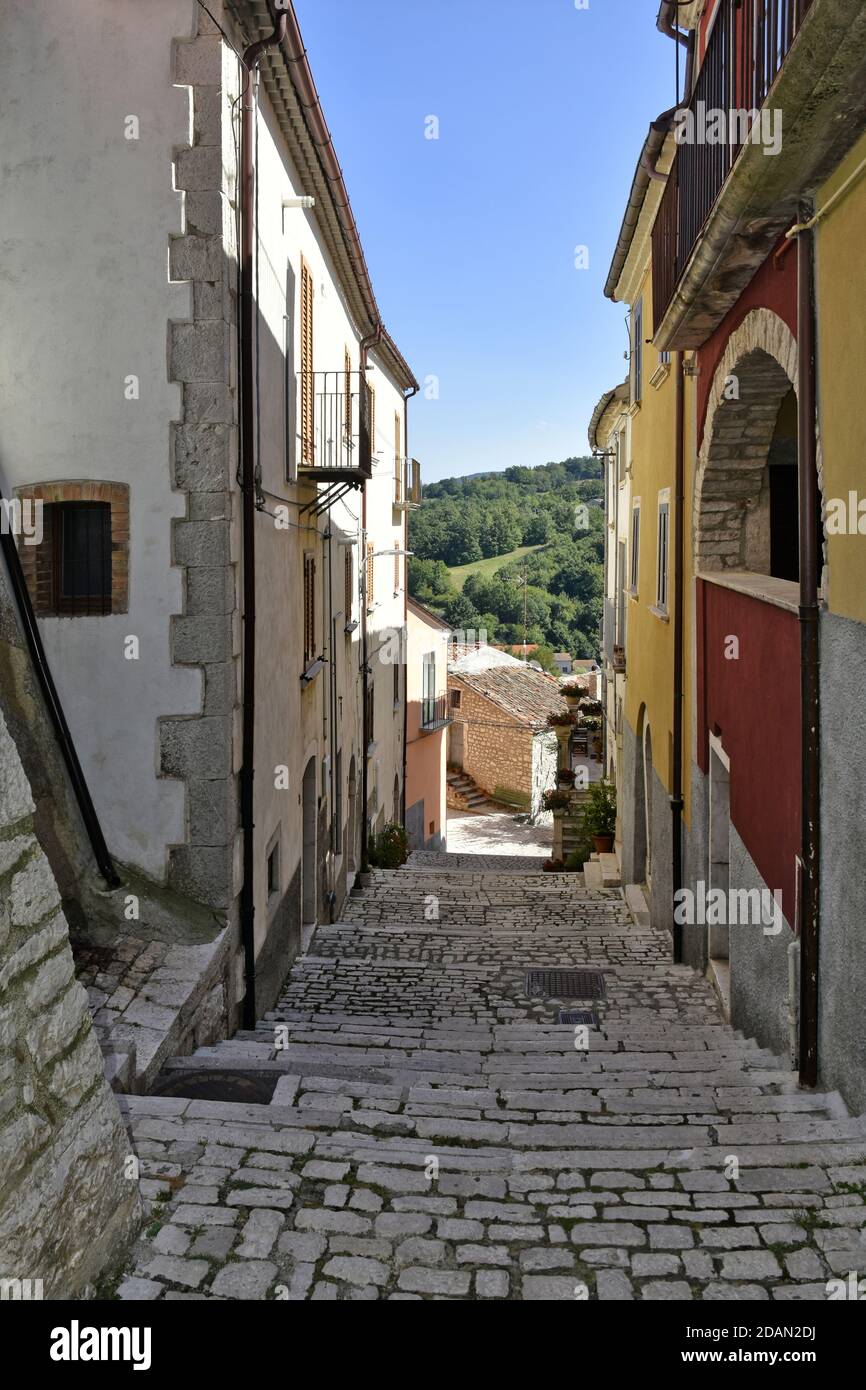 A narrow street among the old houses of Sepino, a medieval village in ...