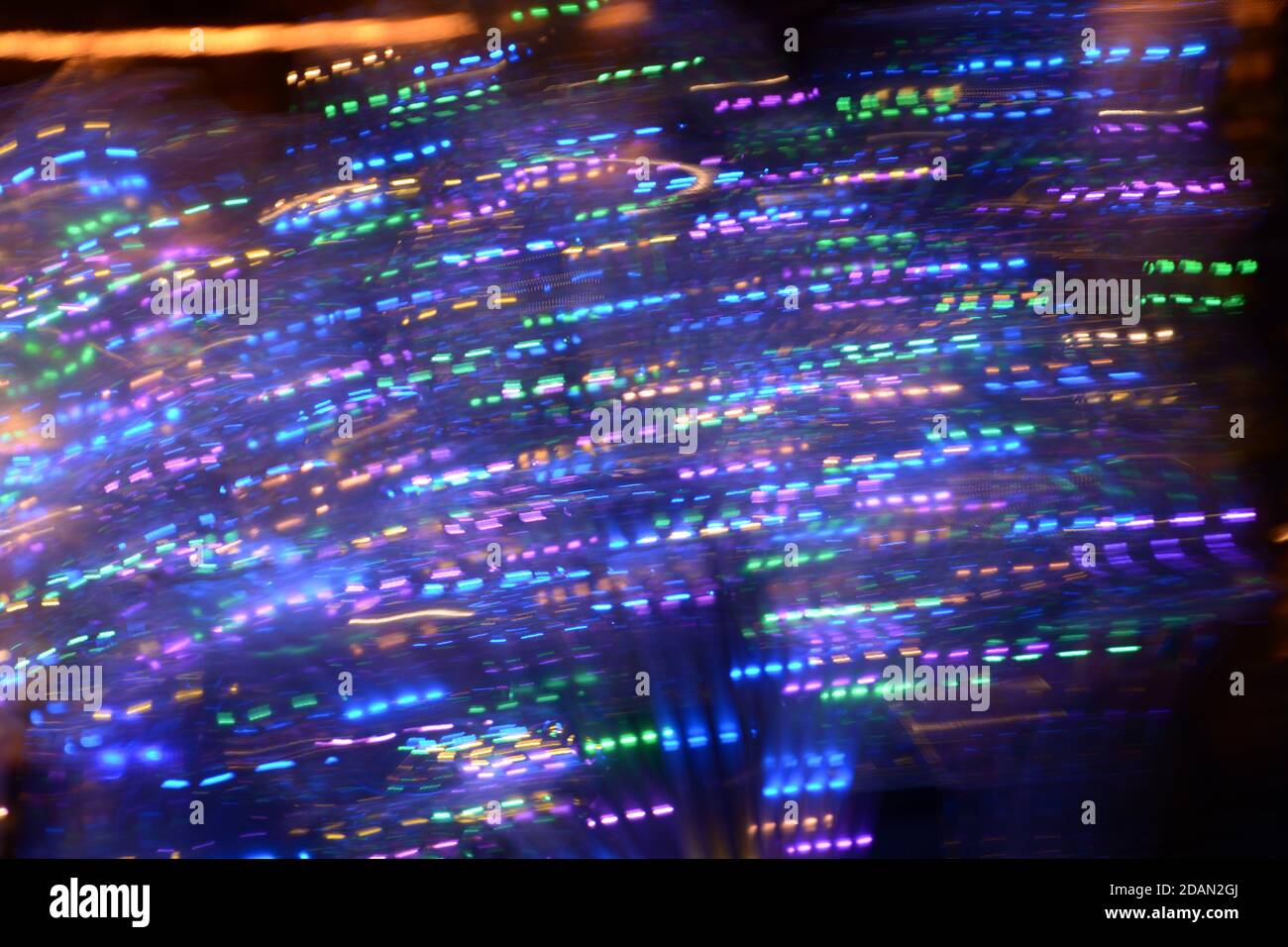 blurred multi colored neon lights at night with bright bokeh effects ...