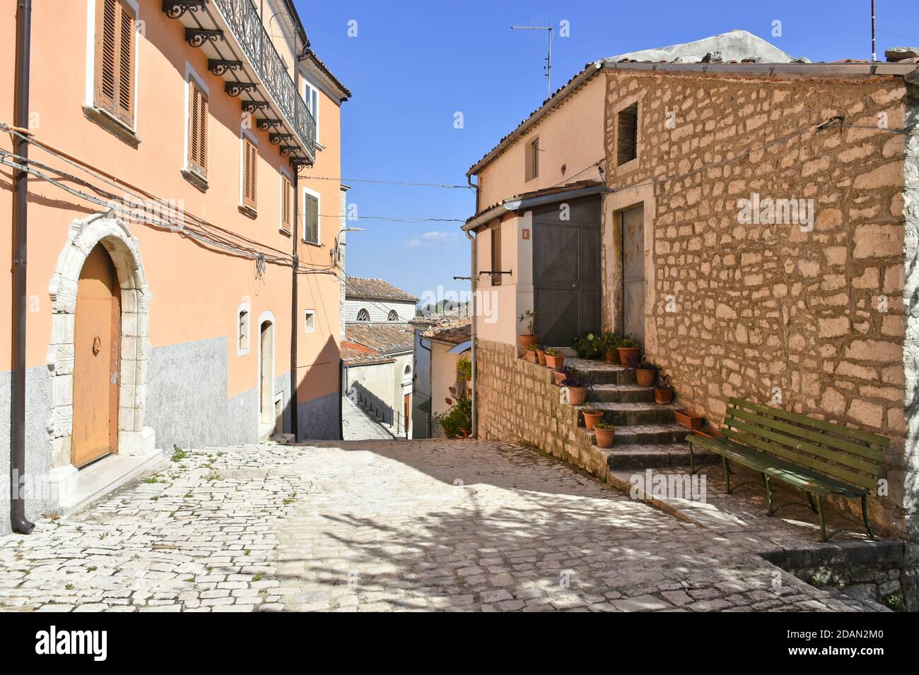 A narrow street among the old houses of Sepino, a medieval village in ...