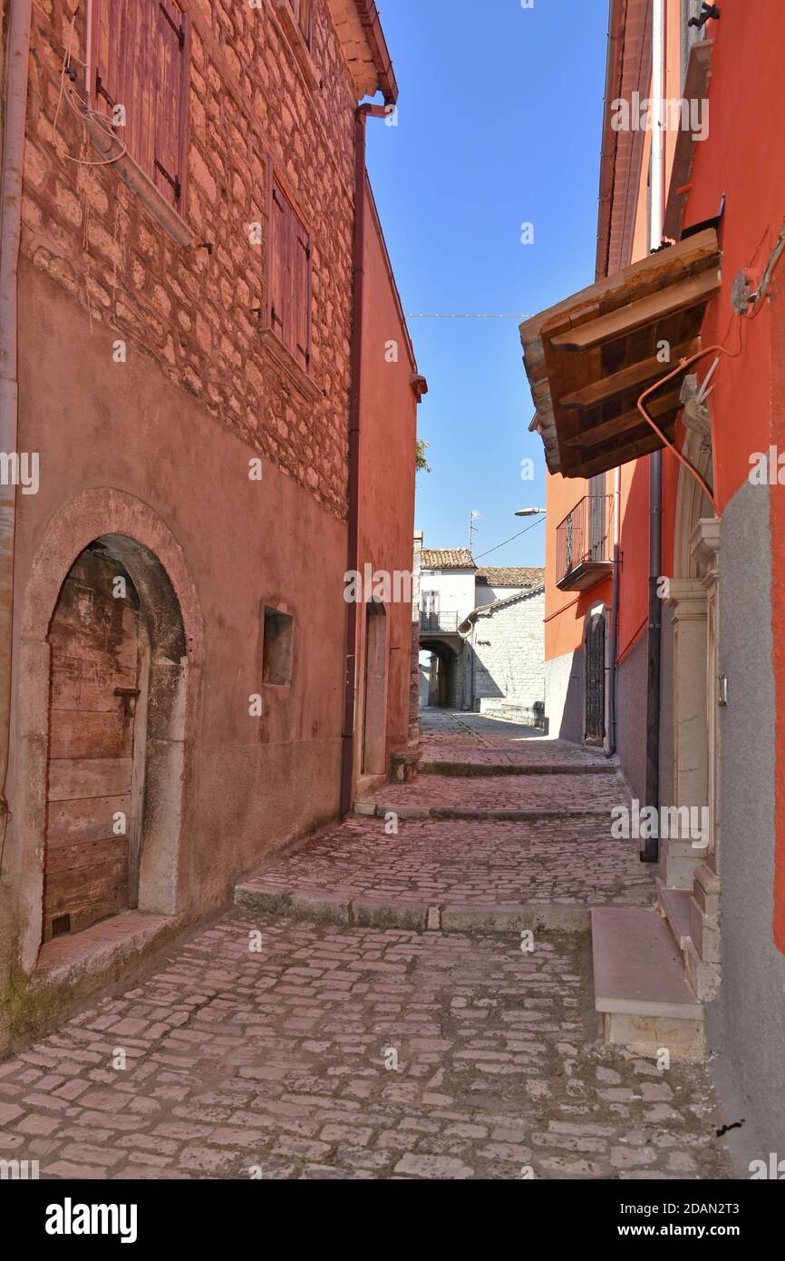 A narrow street among the old houses of Sepino, a medieval village in ...