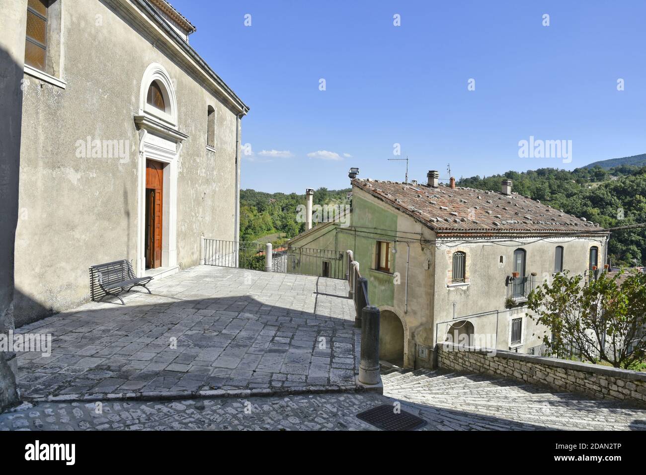 A narrow street among the old houses of Sepino, a medieval village in ...