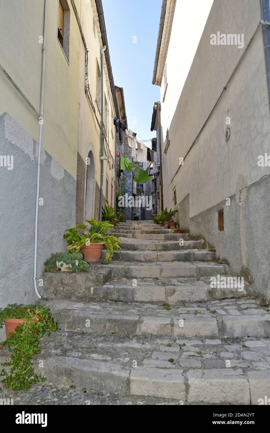 A narrow street among the old houses of Sepino, a medieval village in ...