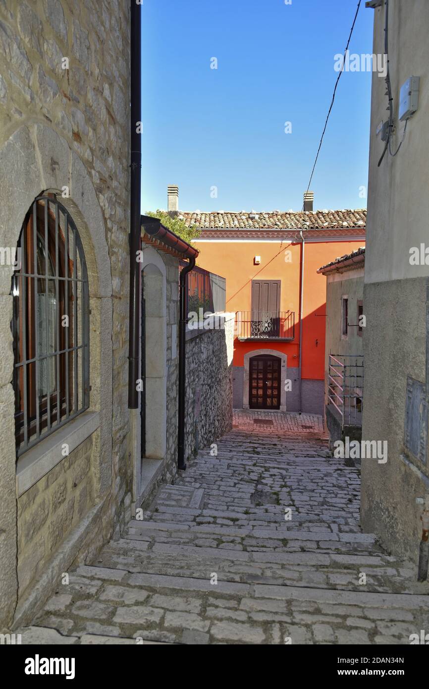 A narrow street among the old houses of Sepino, a medieval village in ...