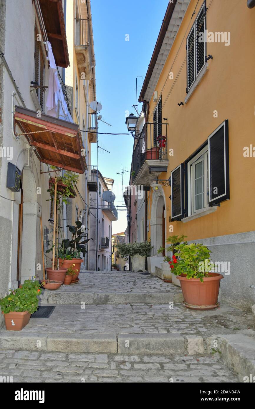 A narrow street among the old houses of Sepino, a medieval village in ...