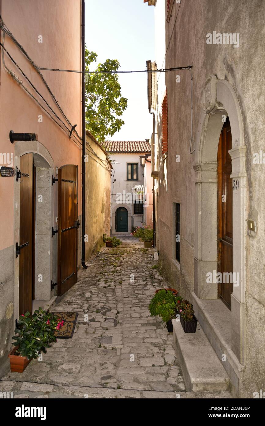 A narrow street among the old houses of Sepino, a medieval village in ...
