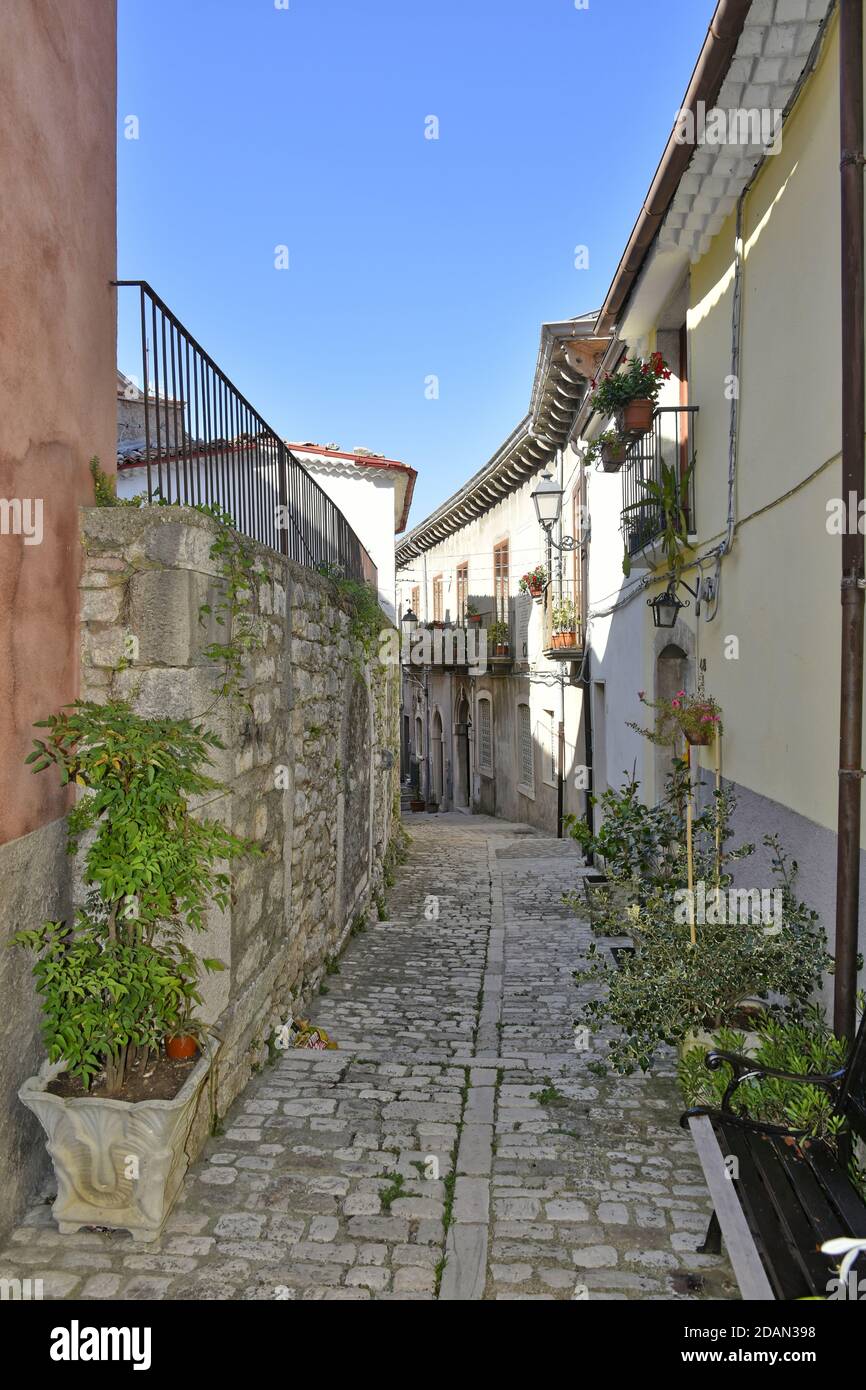 A narrow street among the old houses of Sepino, a medieval village in ...