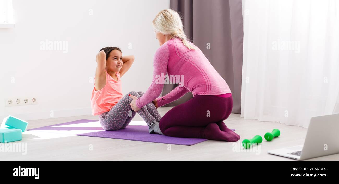 The girl does gymnastics at home. Gymnastics video tutorial. Gymnastic ...