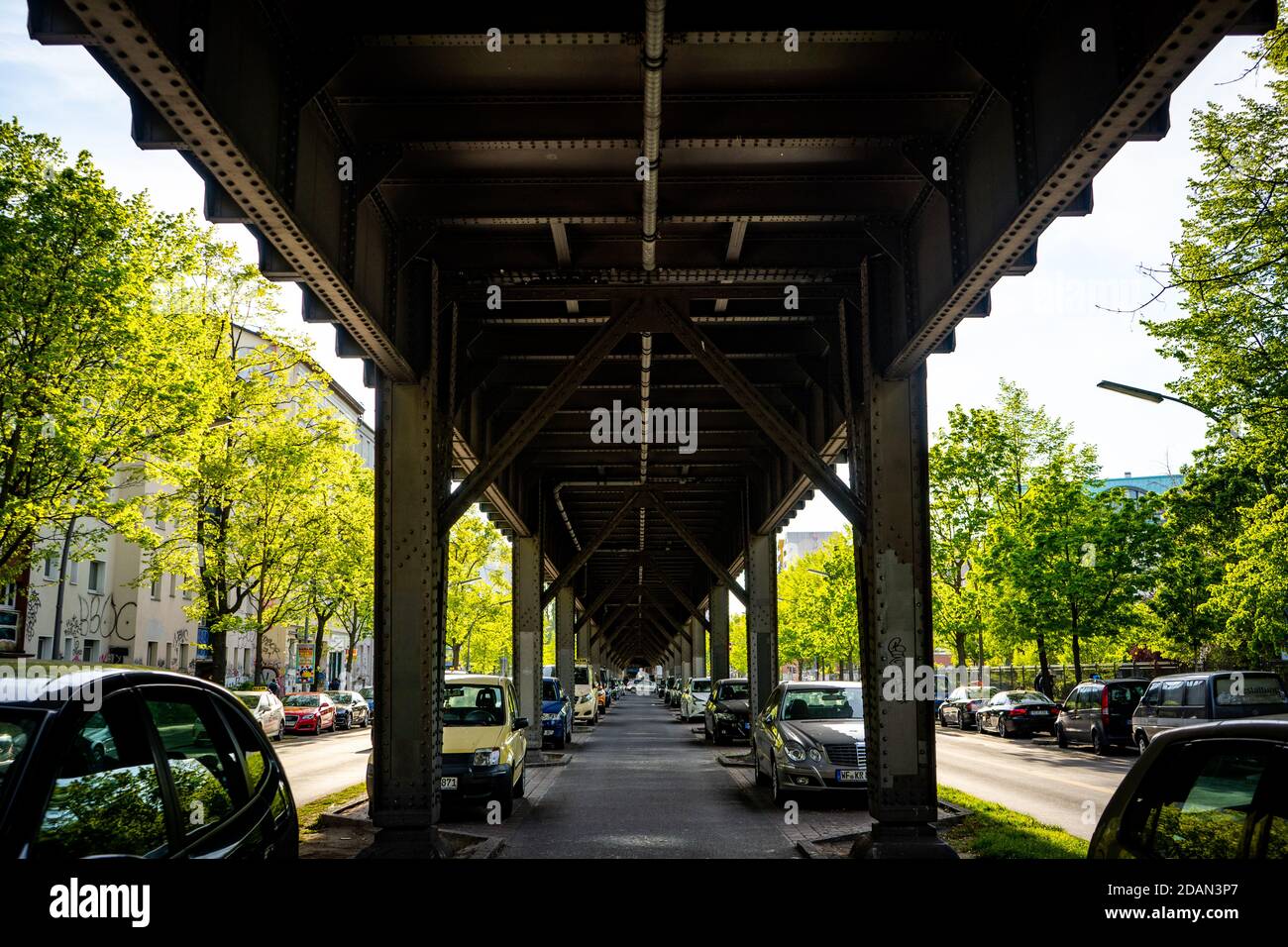 under a railway bridge in the city Stock Photo - Alamy