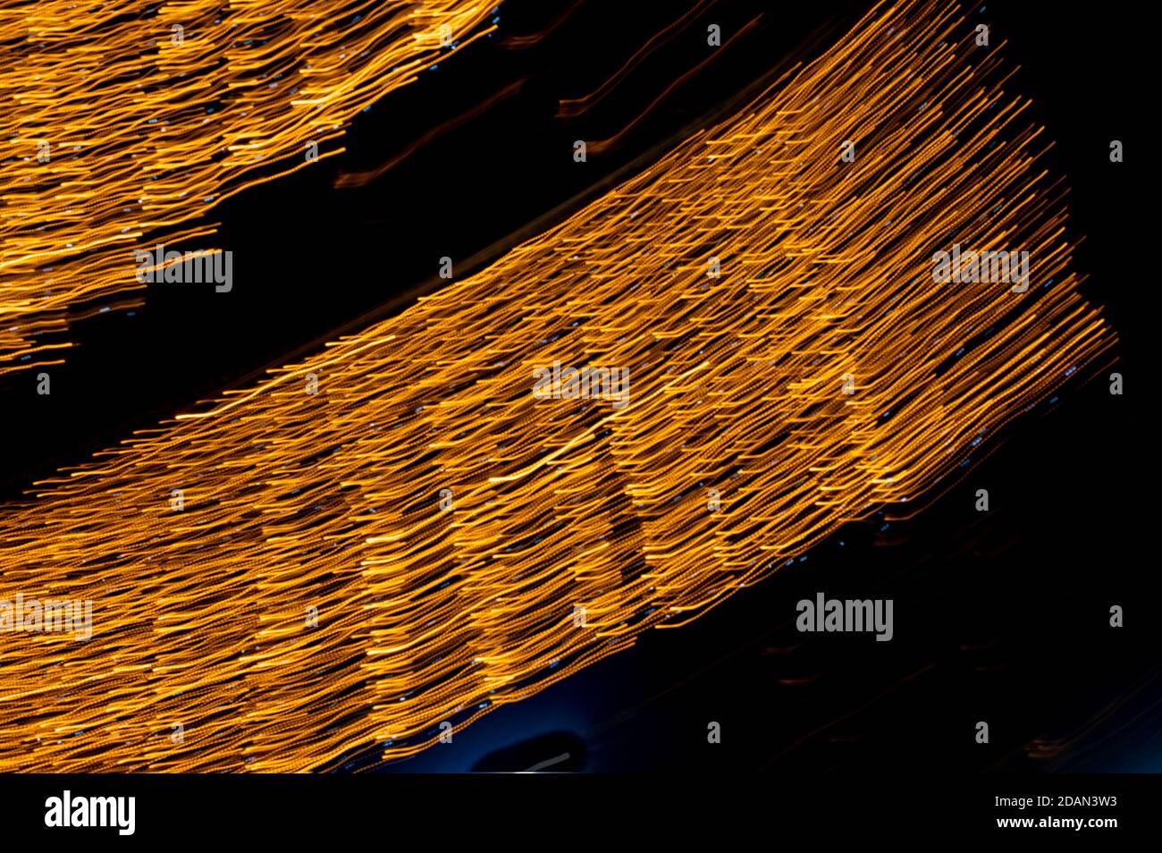 Speed of digital lights in motion. Bright orange neon glowing fast ...