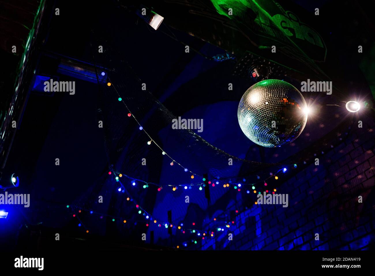 mirror ball reflecting light in a club Stock Photo - Alamy