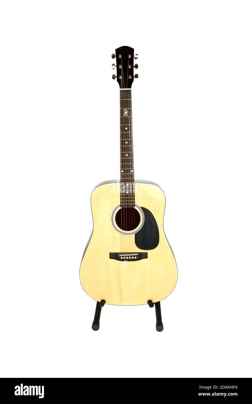 Vertical shot of acoustic guitar on stand isolated on white background ...