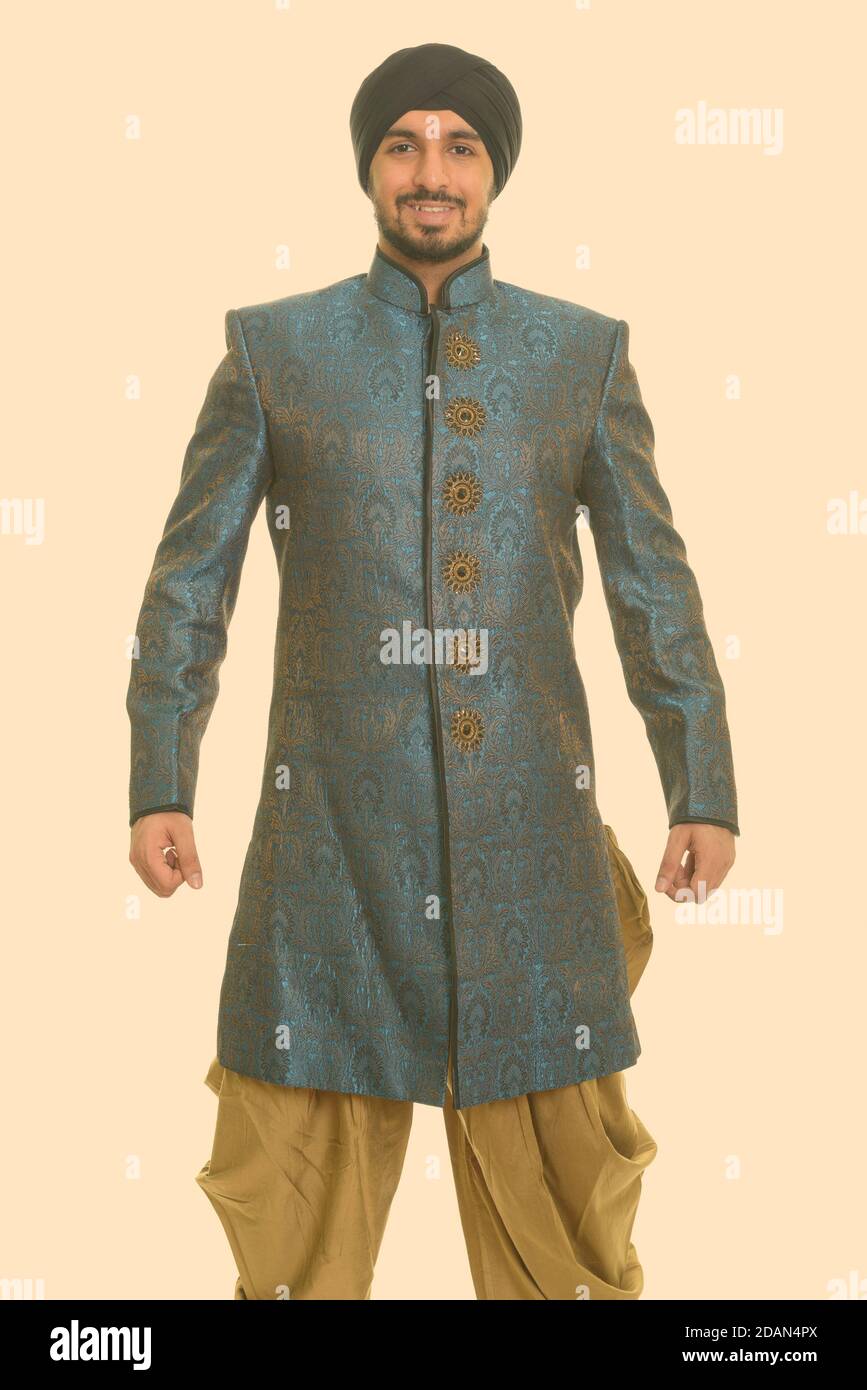 Young happy Indian Sikh man smiling wearing traditional clothes Stock ...