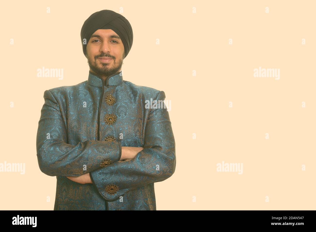 Young handsome Indian Sikh man wearing traditional clothes Stock Photo ...