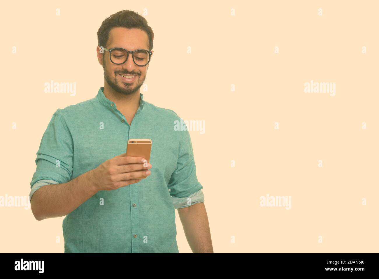 Young happy Indian man using mobile phone Stock Photo - Alamy