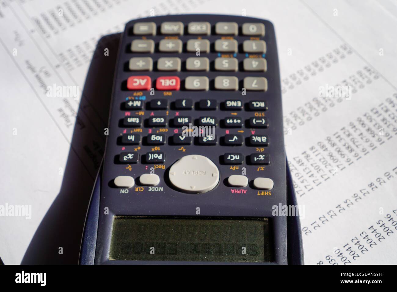 High angle shot of a calculator on a number sheet Stock Photo - Alamy
