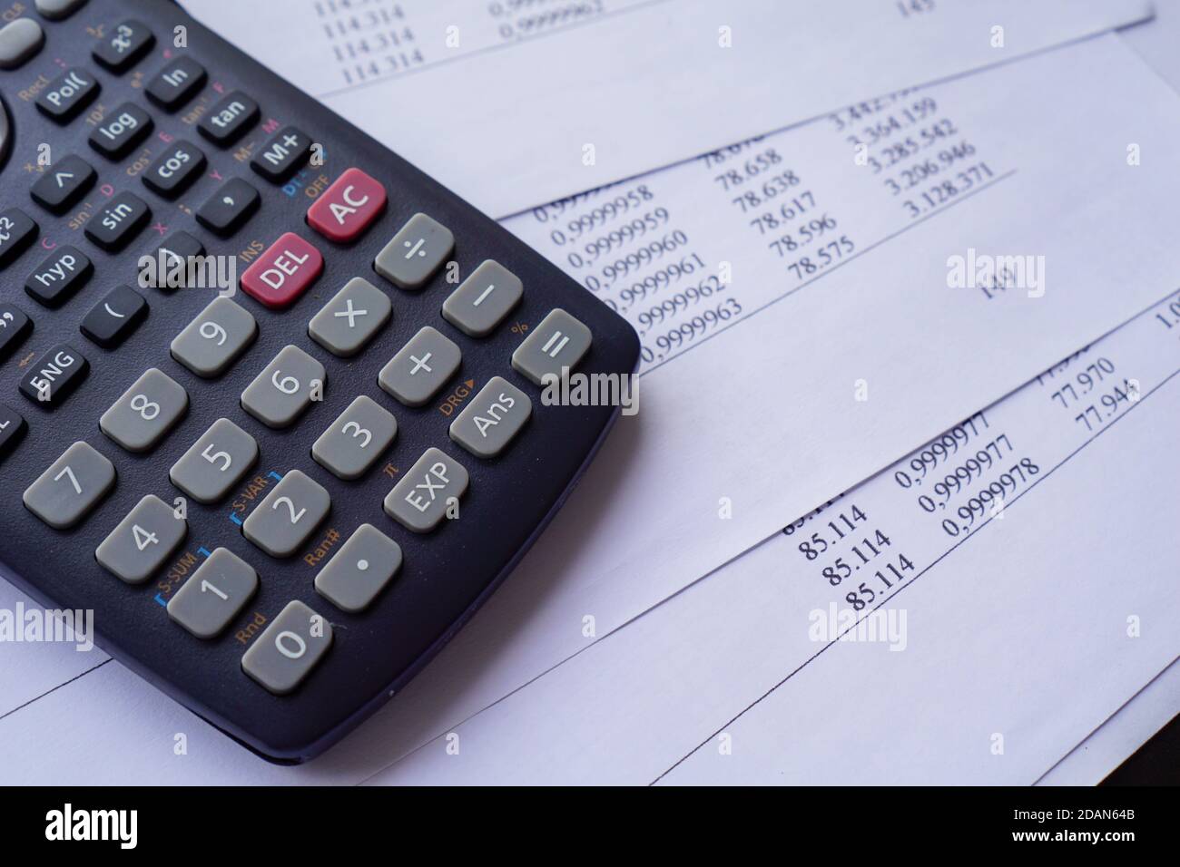 High angle shot of a calculator on a number sheet Stock Photo - Alamy