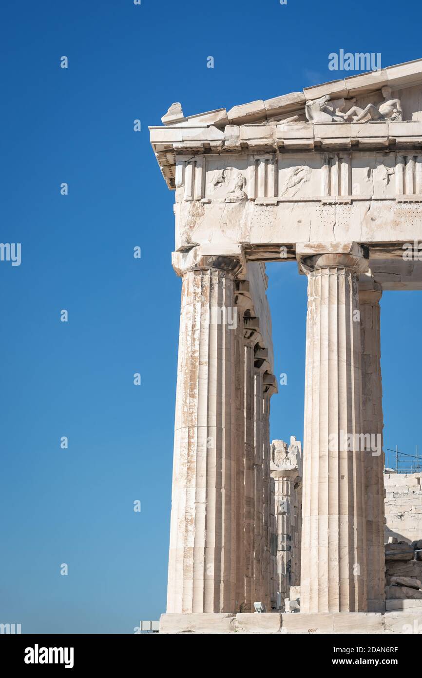 Part of the Parthenon colonnade against the blue sky in vertical format ...