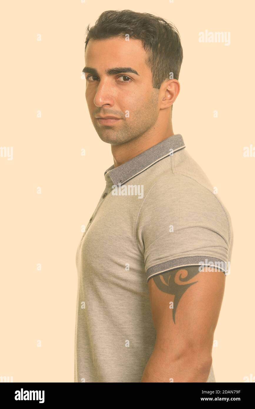 Portrait of young handsome Iranian man looking at camera Stock Photo ...