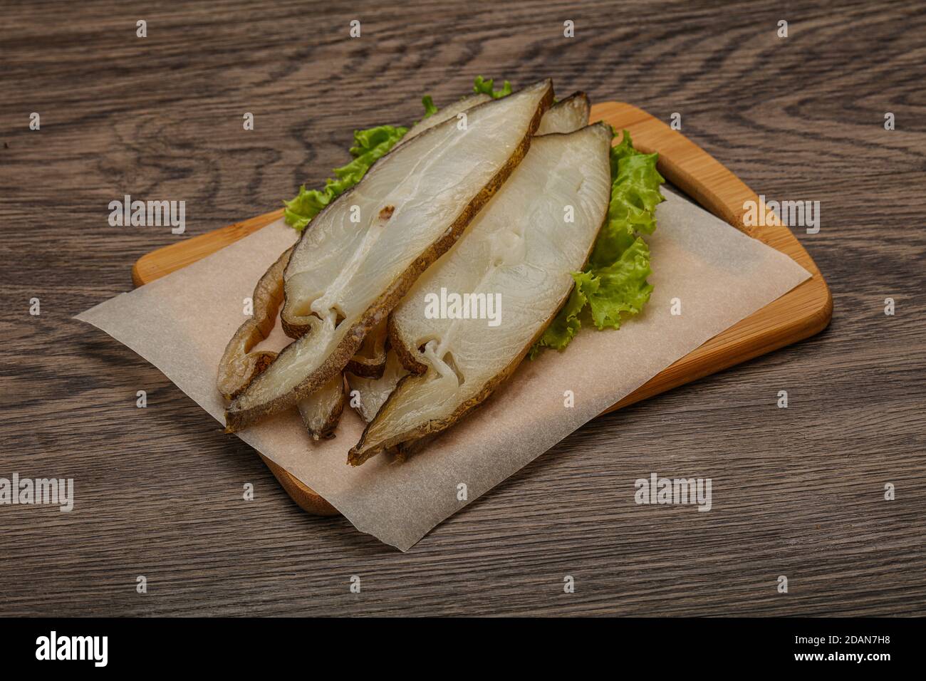 Delicous smoked halibut fish slices snack Stock Photo - Alamy