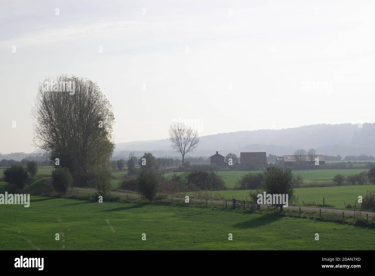 Old Dutch house standing in front of a small river in a Dutch polder ...