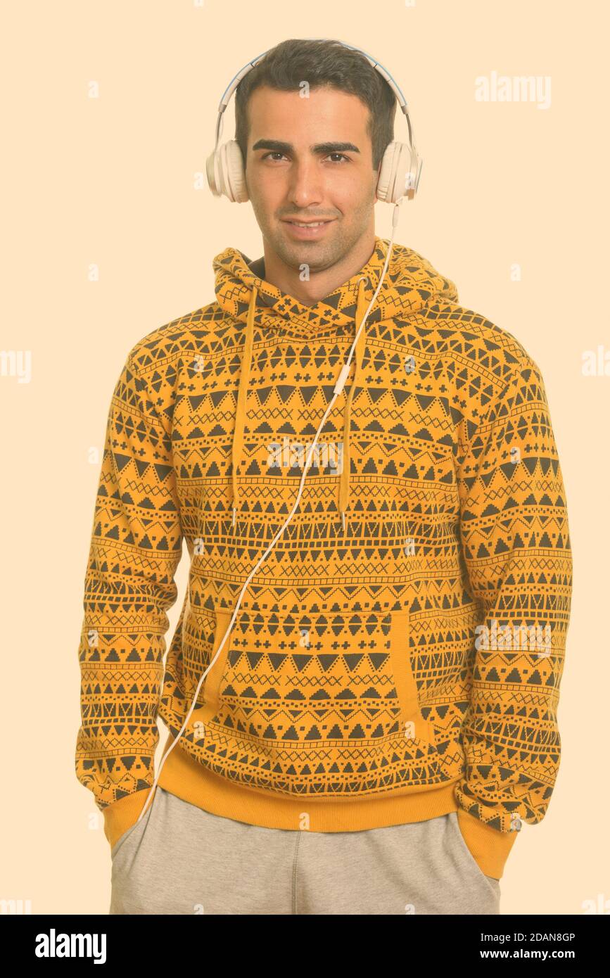 Young happy Iranian man listening to music Stock Photo - Alamy