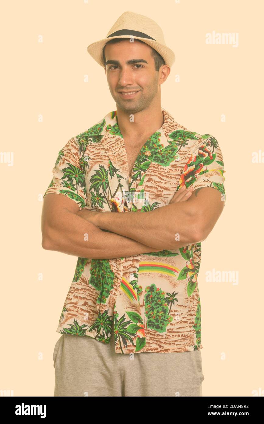 Young happy Iranian man smiling ready for vacation Stock Photo - Alamy