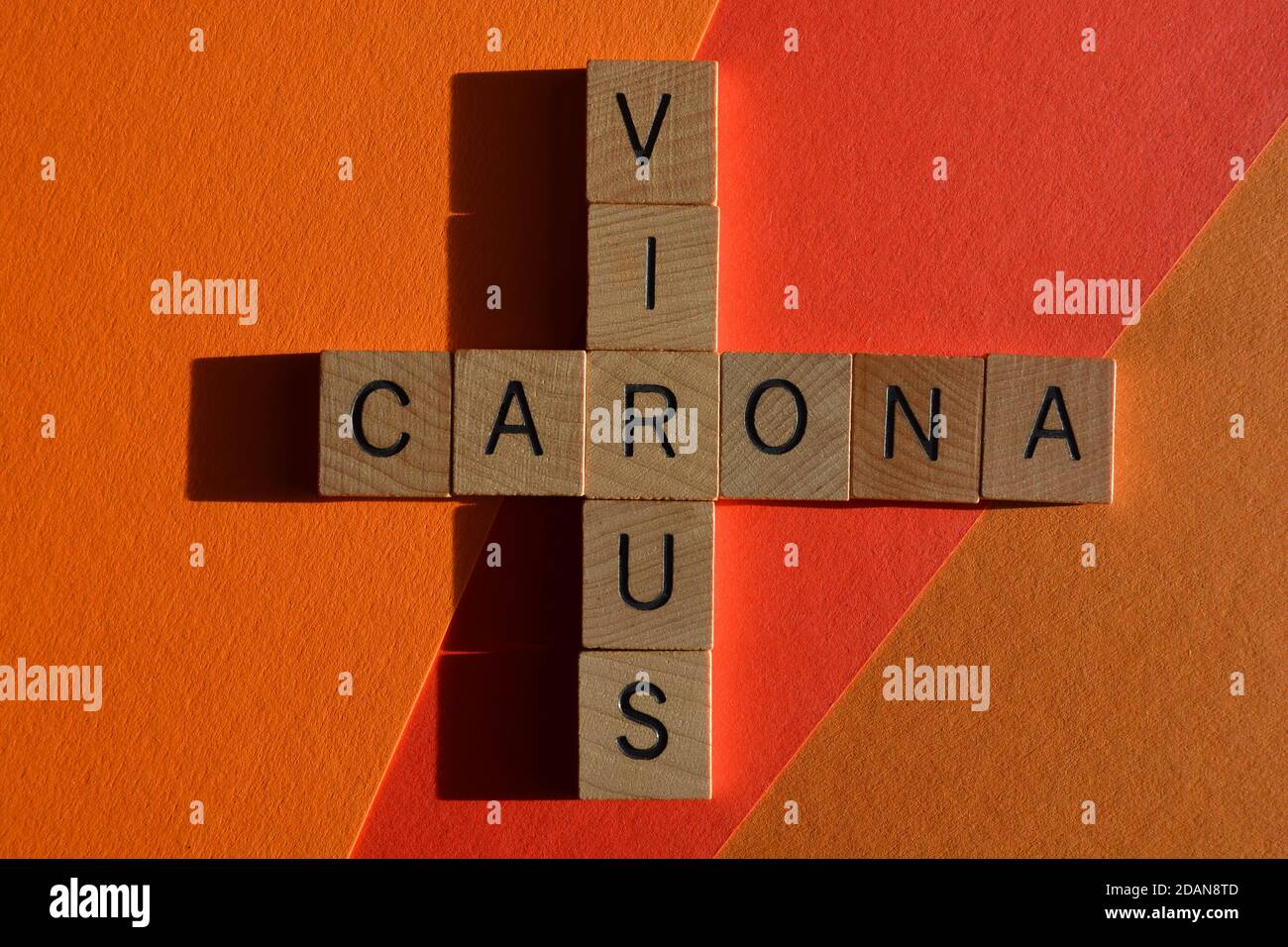 Carona Virus, words in wooden alphabet letters in crossword form Stock ...
