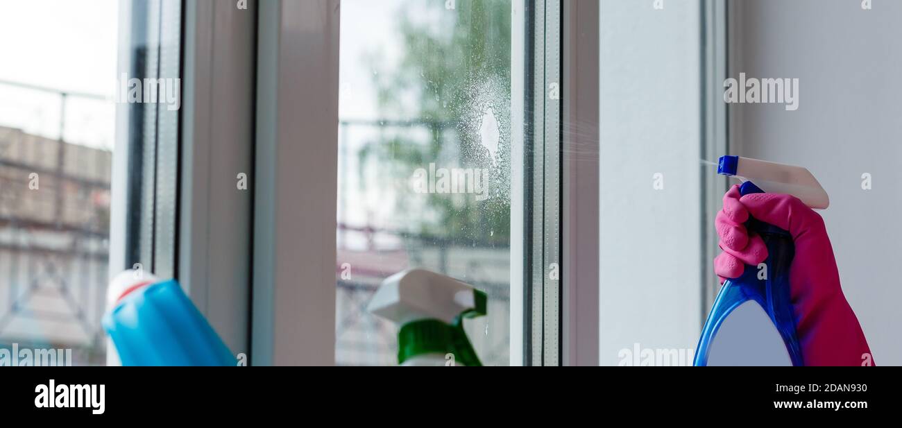 before and after concept - close up of female hand cleaning window with ...