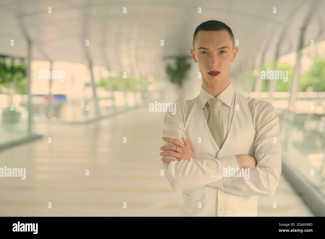 Young handsome androgynous businessman exploring the city of Bangkok ...