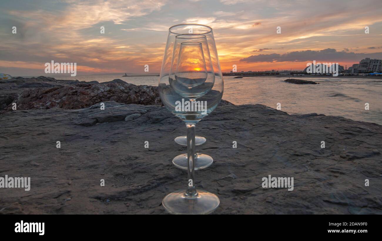 Reflection in a glass at sunset on a beach Stock Photo - Alamy