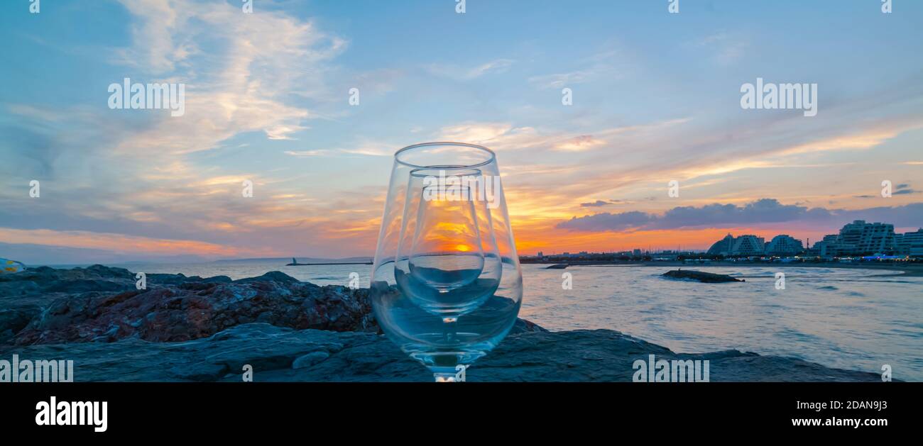Reflection in a glass at sunset on a beach Stock Photo - Alamy