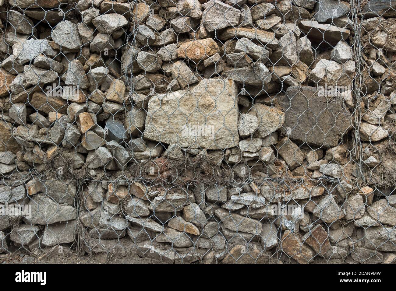 Gabion fence from mesh with stones Stock Photo - Alamy