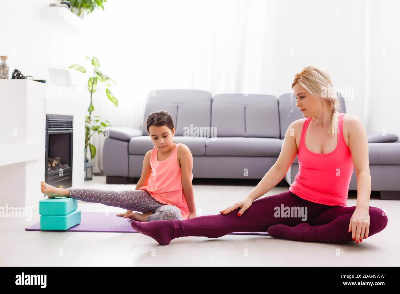 The girl does gymnastics at home. Gymnastics video tutorial. Gymnastic ...