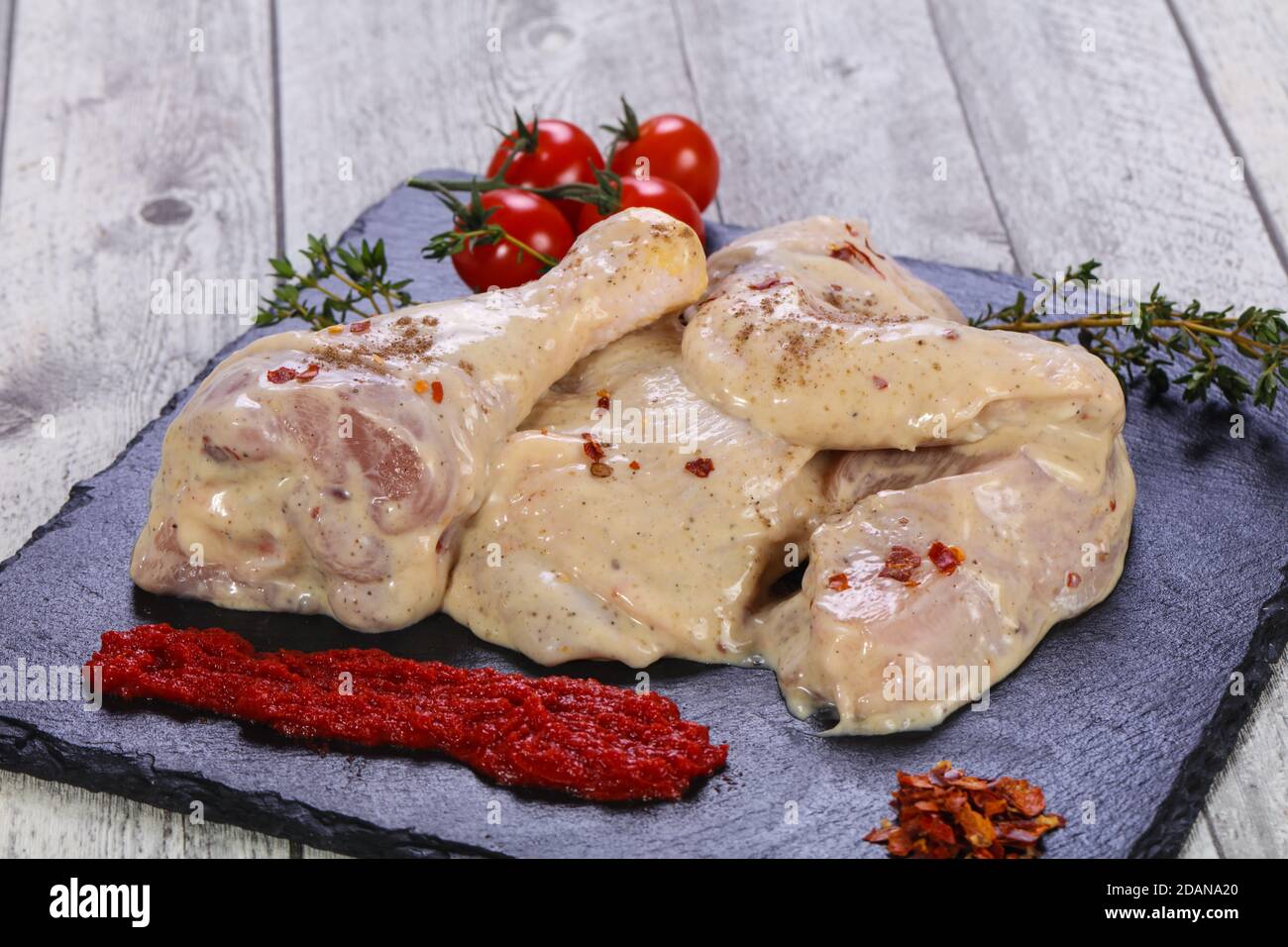 Marinated chicken parts ready for roast Stock Photo - Alamy
