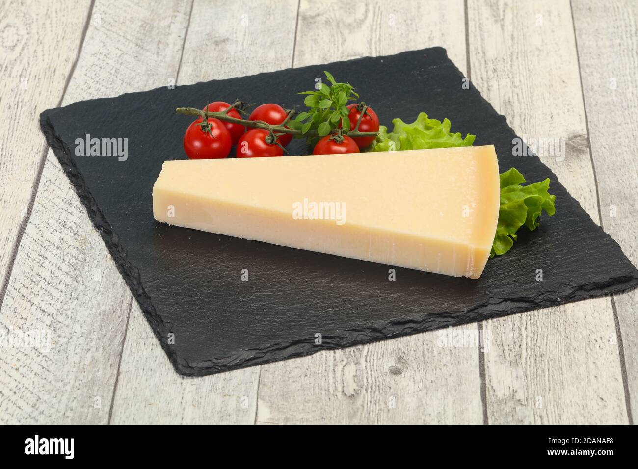 Italian traditional parmesan cheese triangle served salad Stock Photo ...