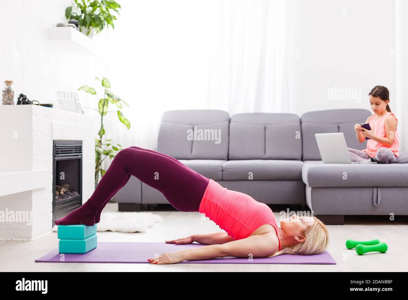 Horizontal view of a woman doing yoga at home Stock Photo - Alamy