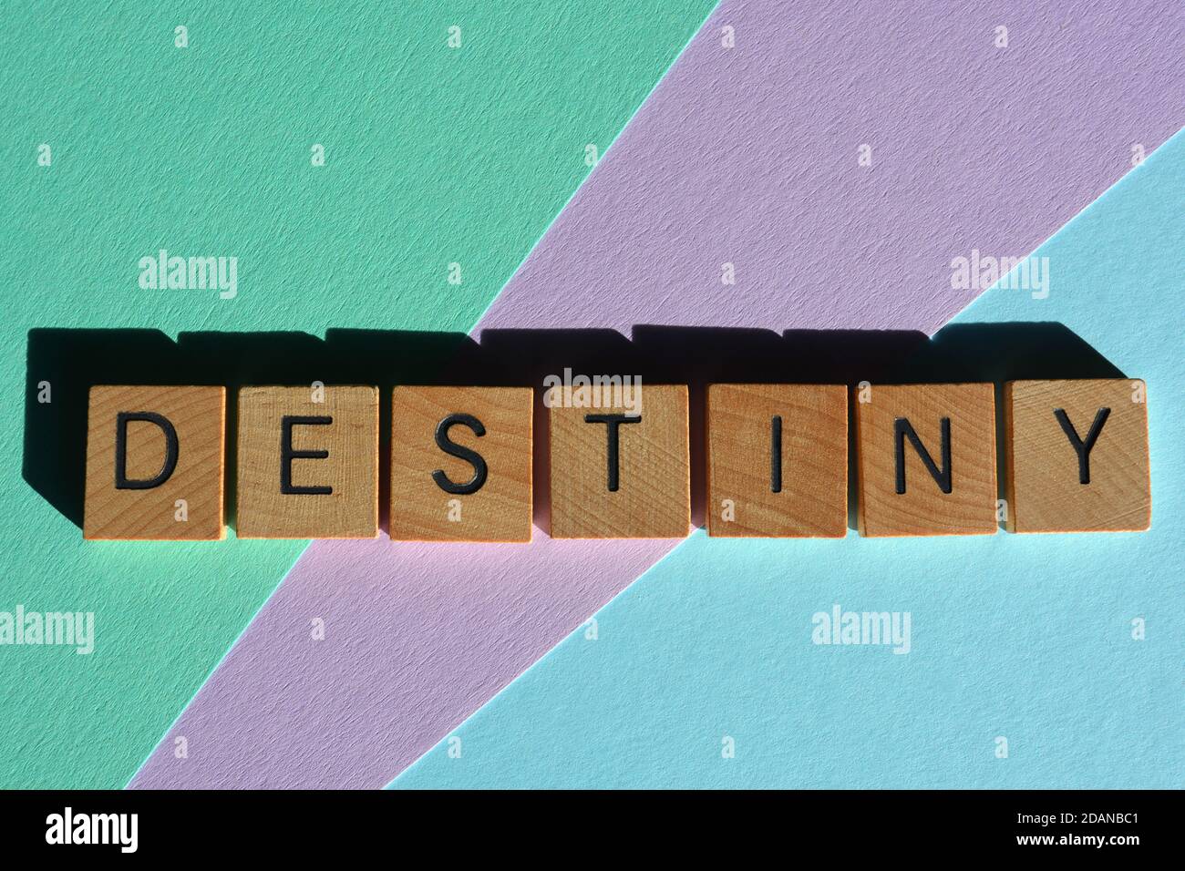 Destiny, word in wooden alphabet letters isolated on pastel background ...