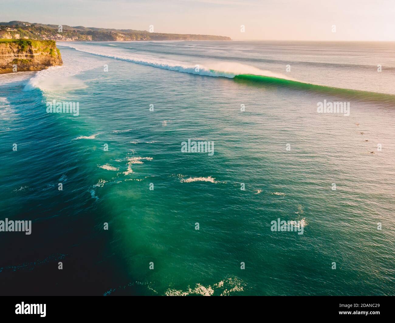 Aerial view of green waves at sunset. Big ocean waves for surfing in ...