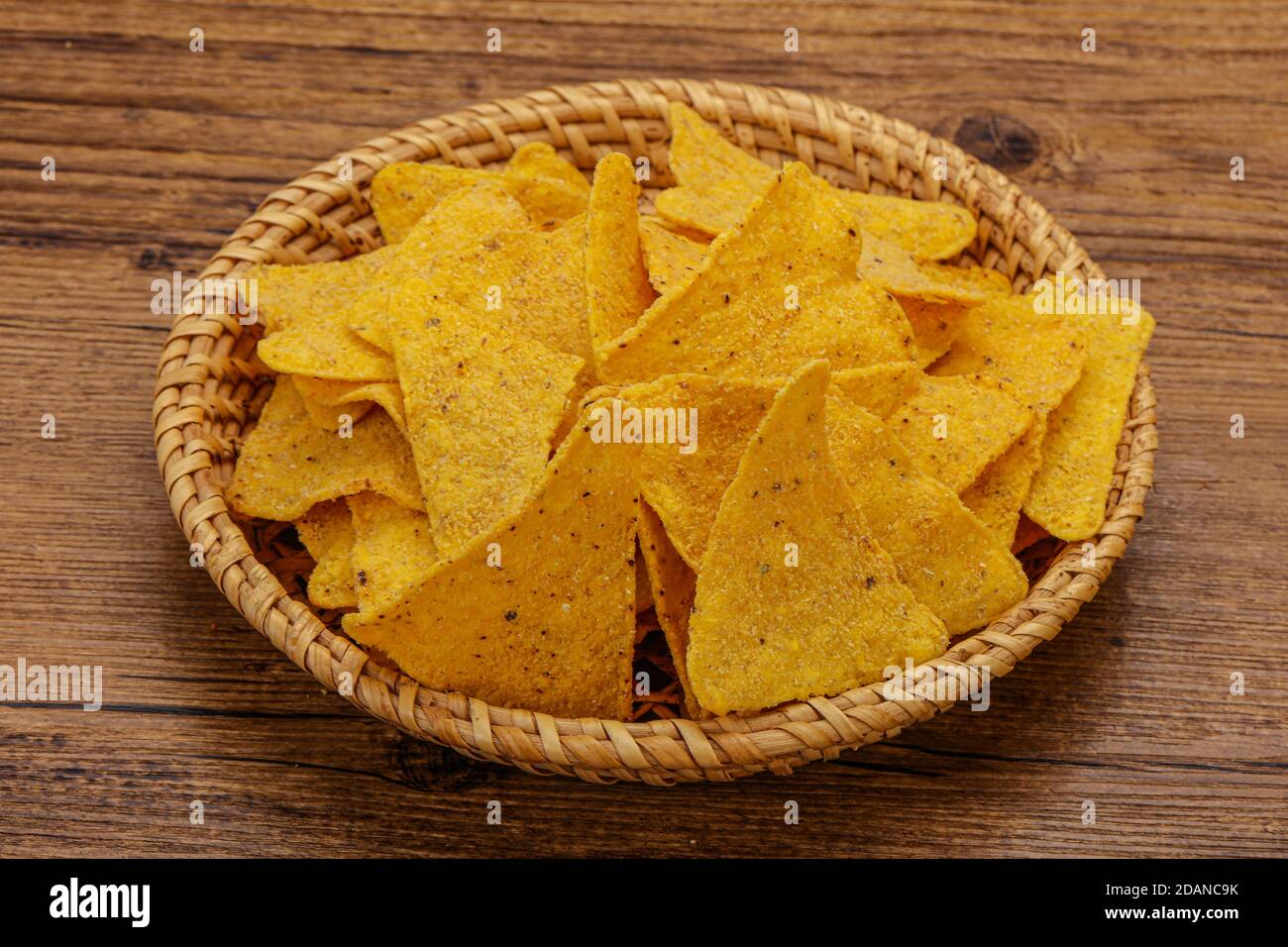 Mexican crunchy corn nachos triangle heap Stock Photo - Alamy