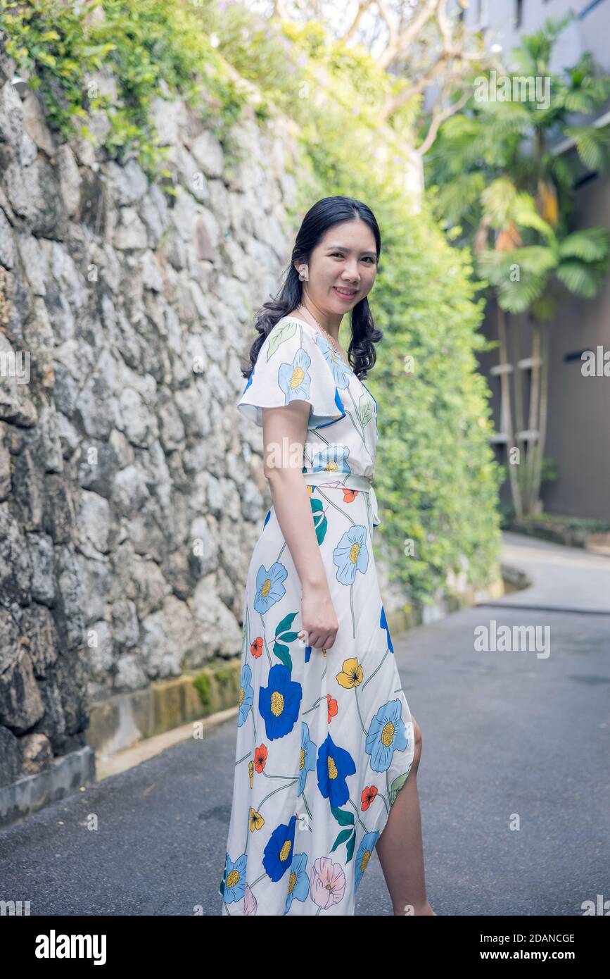 Beautiful asian woman walking through the alley Stock Photo - Alamy