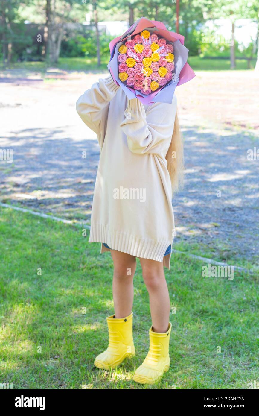 Girl wrapping hands yellow hi-res stock photography and images - Alamy
